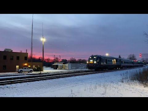 The Amtrak Wolverine 352 is passing by at the freight yard with a nice ...