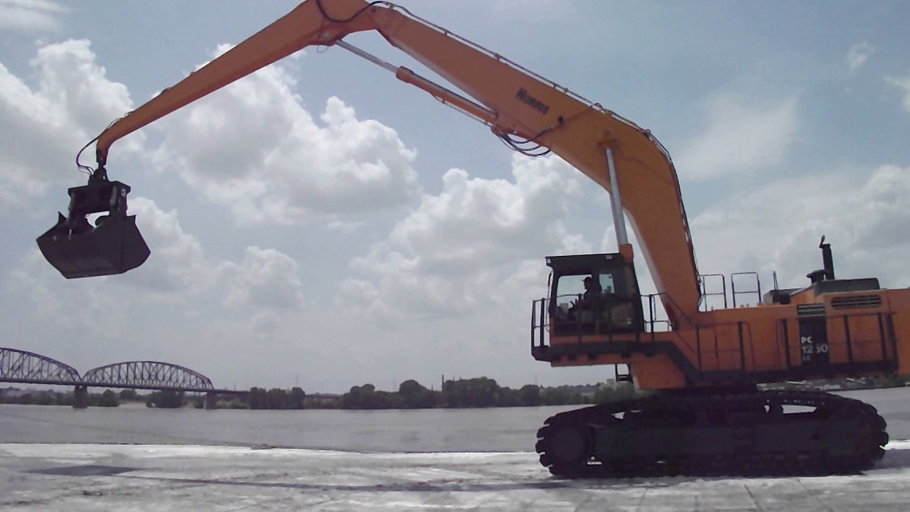 Komatsu PC1250 with custom material handler boom and cab - YouTube