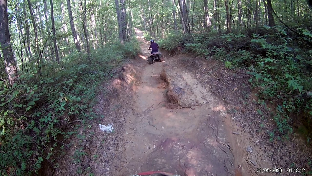 riding four wheeler through trails at red fox part 3 - YouTube