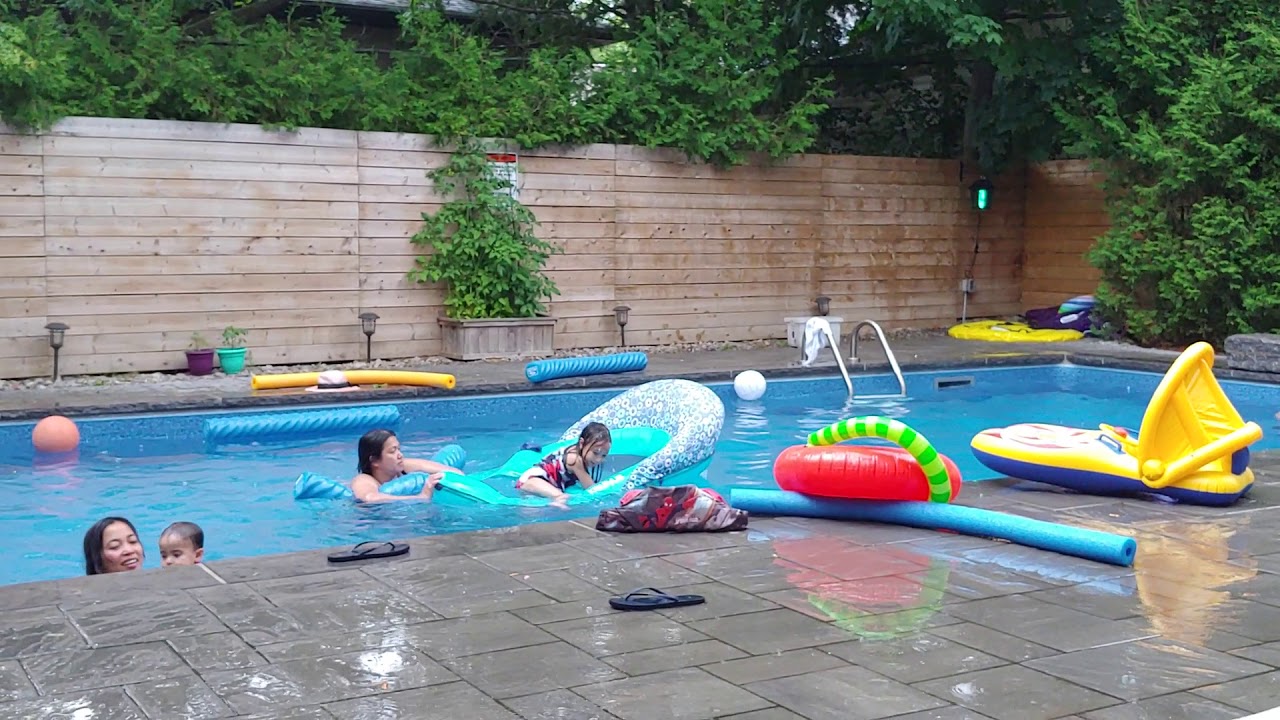 Ariana & Olivia swimming while raining - YouTube