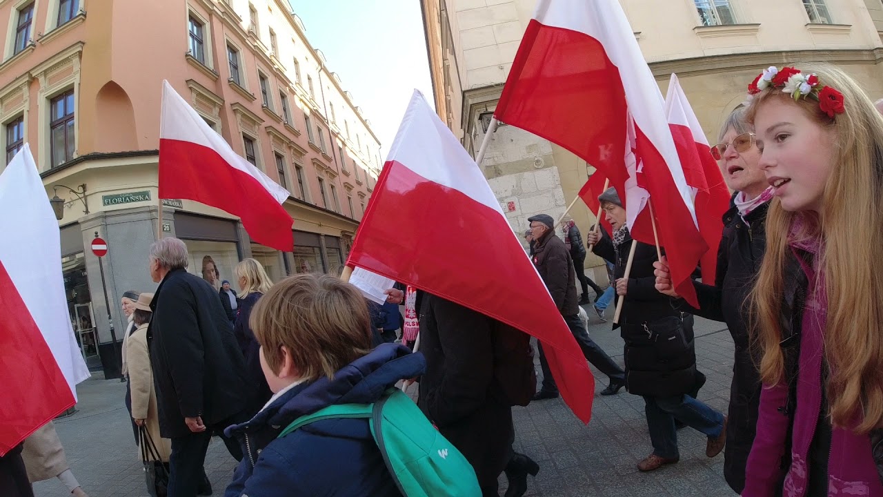 Polish patriots singing on Ulica Florianska in Krakow on independence ...