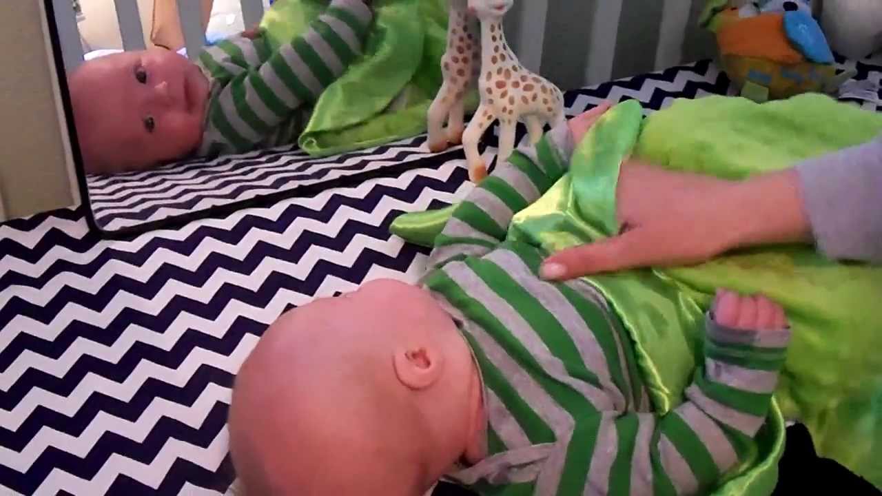 Baby Fascinated With Mirror Reflection in Crib - YouTube