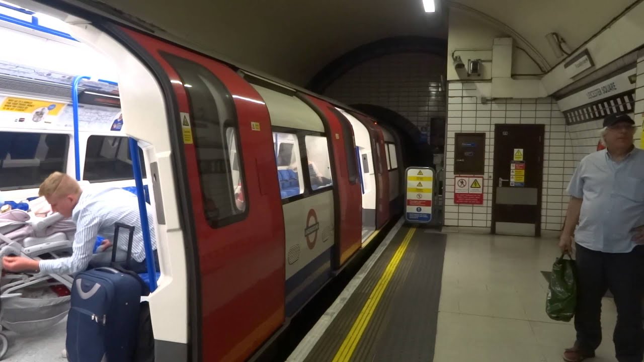Northern Line train arriving at and departing from Leicester Square ...