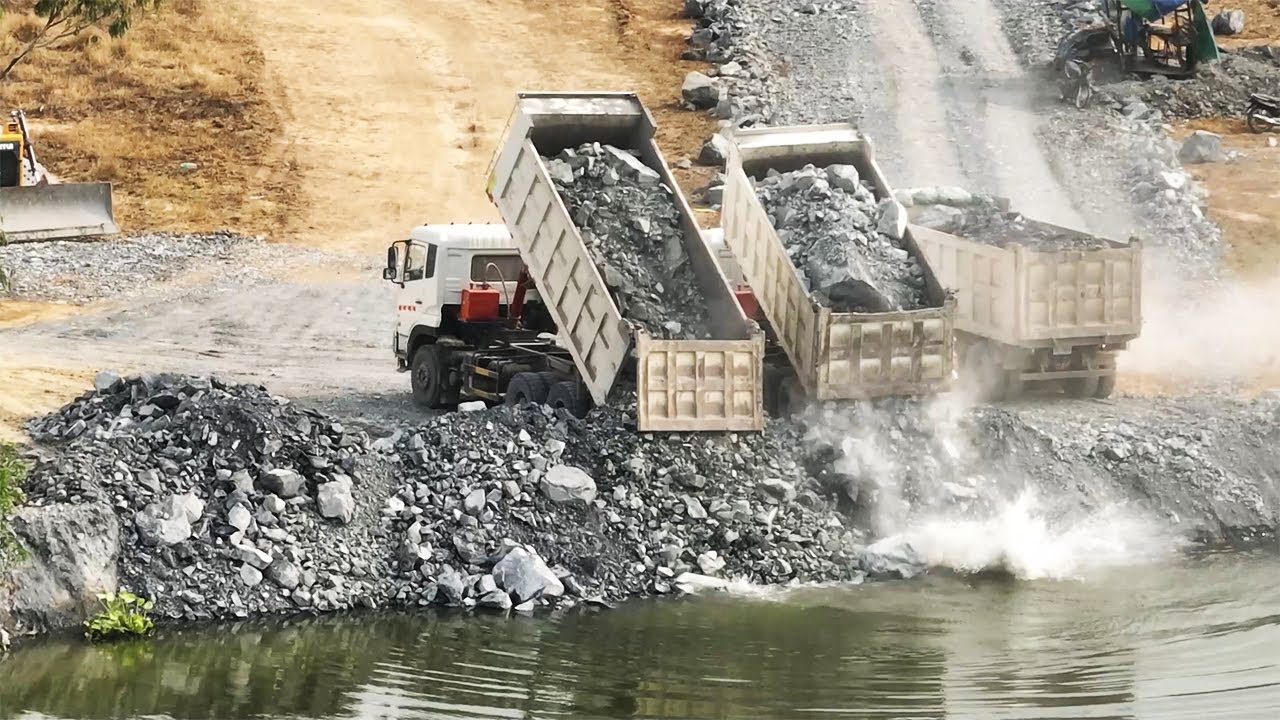 Watch Fantastic Dump Truck Dumping Rocks into Deep Water While ...