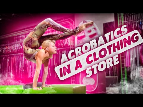 Acrobatics in a clothing store. Handstanding and backbending poses ...