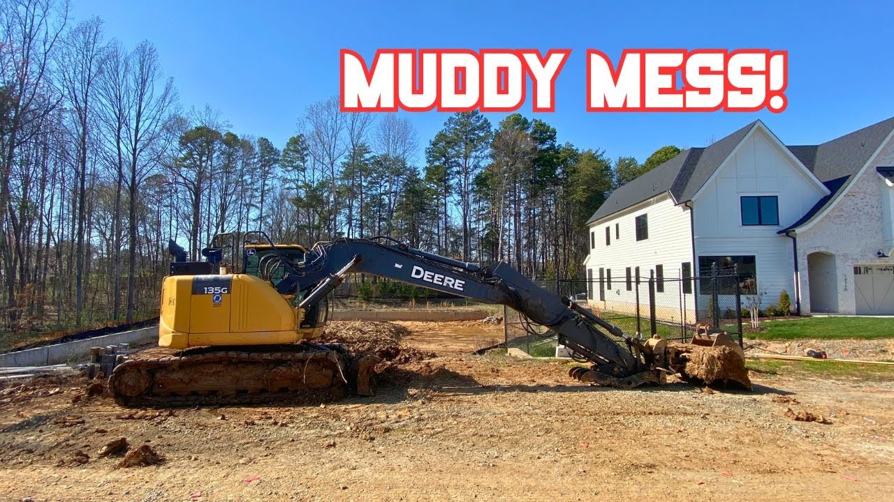 Mucking out a sand filter with a DEERE 135G - YouTube
