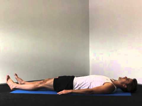 Isometric quadriceps contraction in lying - YouTube