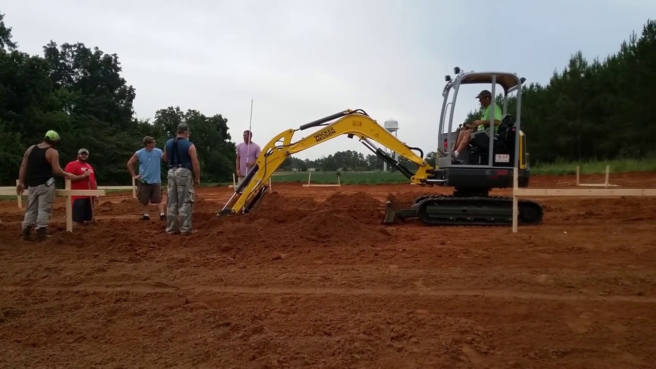 Digging the house footers - YouTube