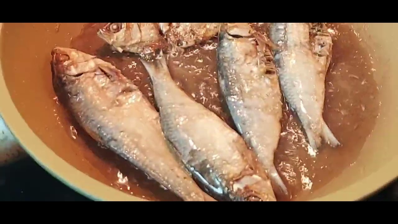 Salted fish, tuyo. .. lets fry it. for my lunch.. with onion and tomato ...