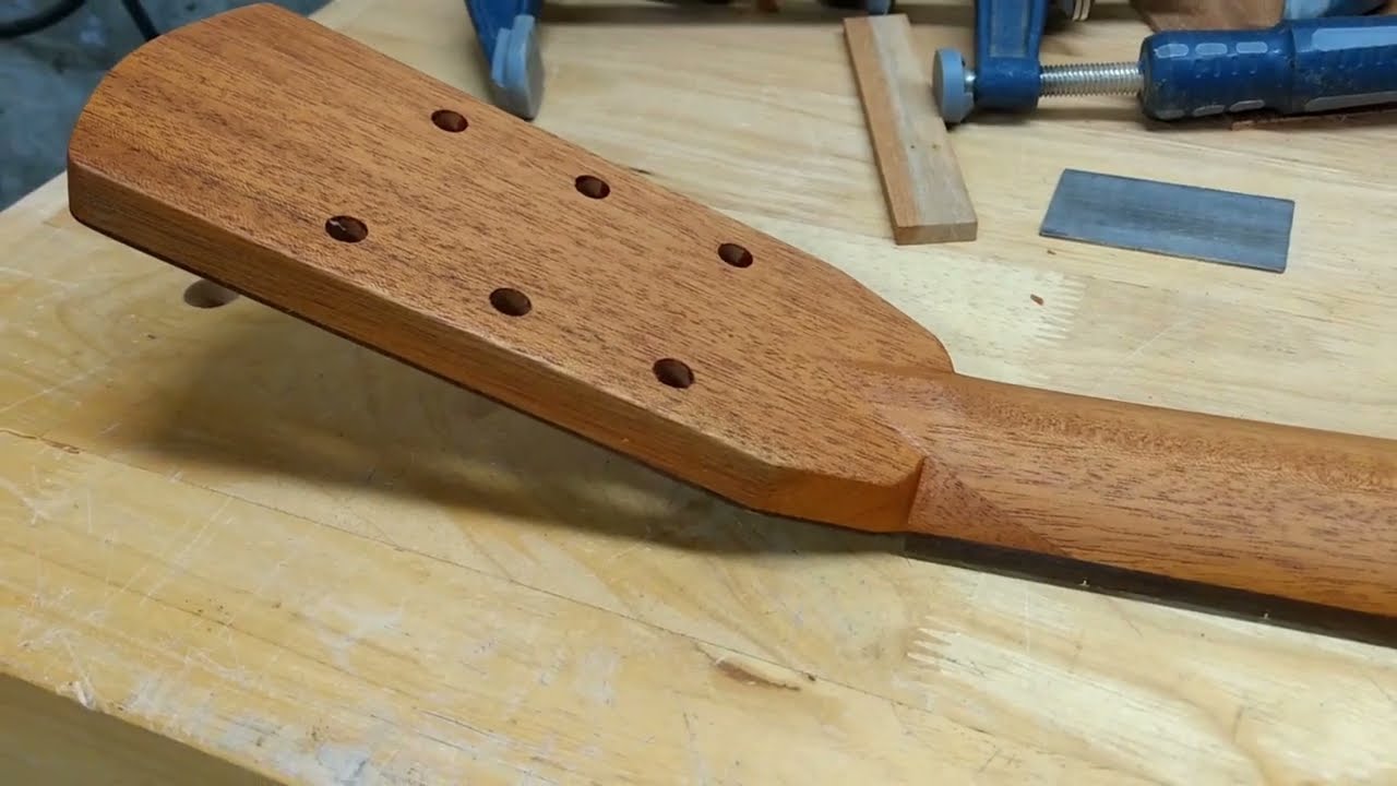The hand carved neck and volute - closeup - YouTube