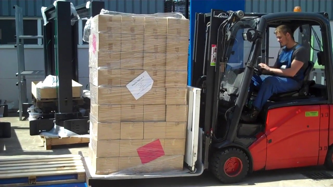 Stationay Pallet Changer Transferring goods to Push Pull attachment ...