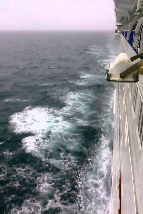 Ship cutting through water - YouTube