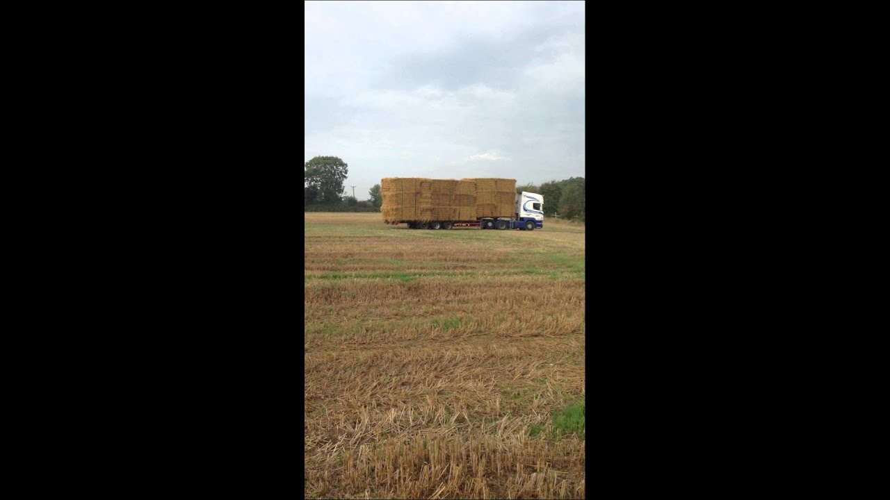 Flat out carting straw bales in Ireland - YouTube
