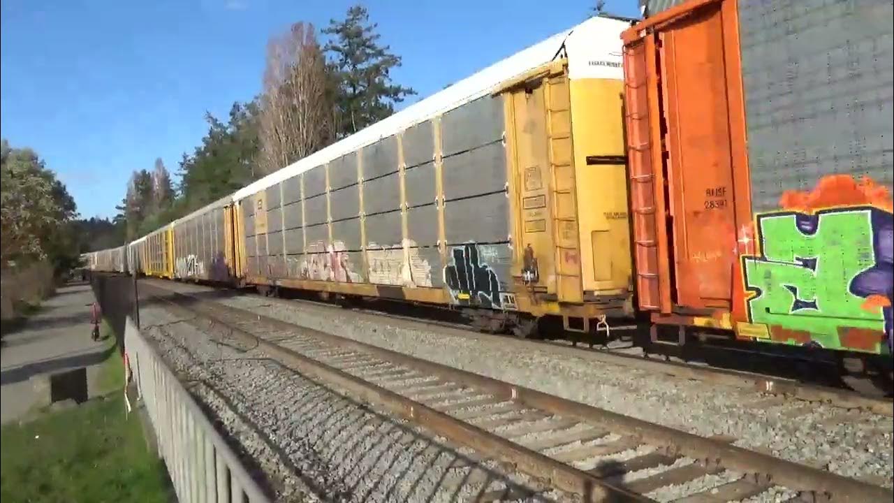 (Southbound) BNSF Autorack Train passes through the Titlow Beach Railroad Crossing. - YouTube