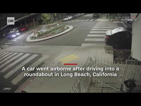 Car goes airborne after smashing into a roundabout - YouTube