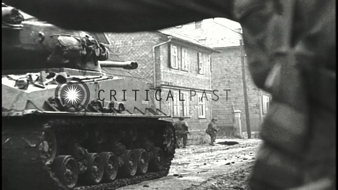 Tanks and troops of the 6th Armored Division enter Oberdorla, Germany ...
