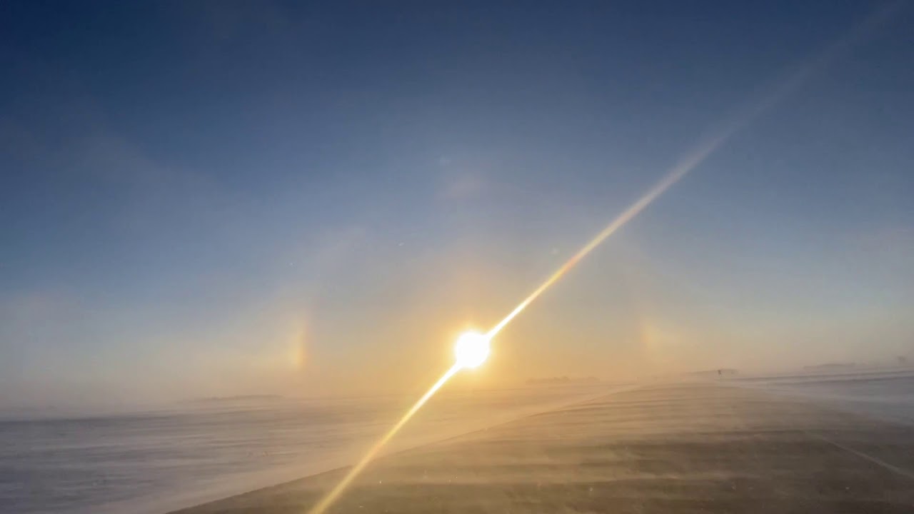 Vivid sun dog spotted shining over frozen Minnesota fields - YouTube
