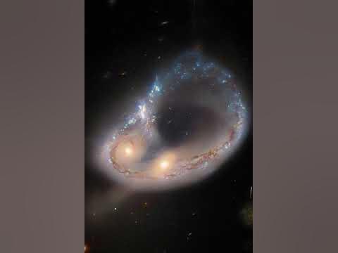Hubble Showcases a Magnificent Galactic Collision in Seyfert's Symphony - YouTube