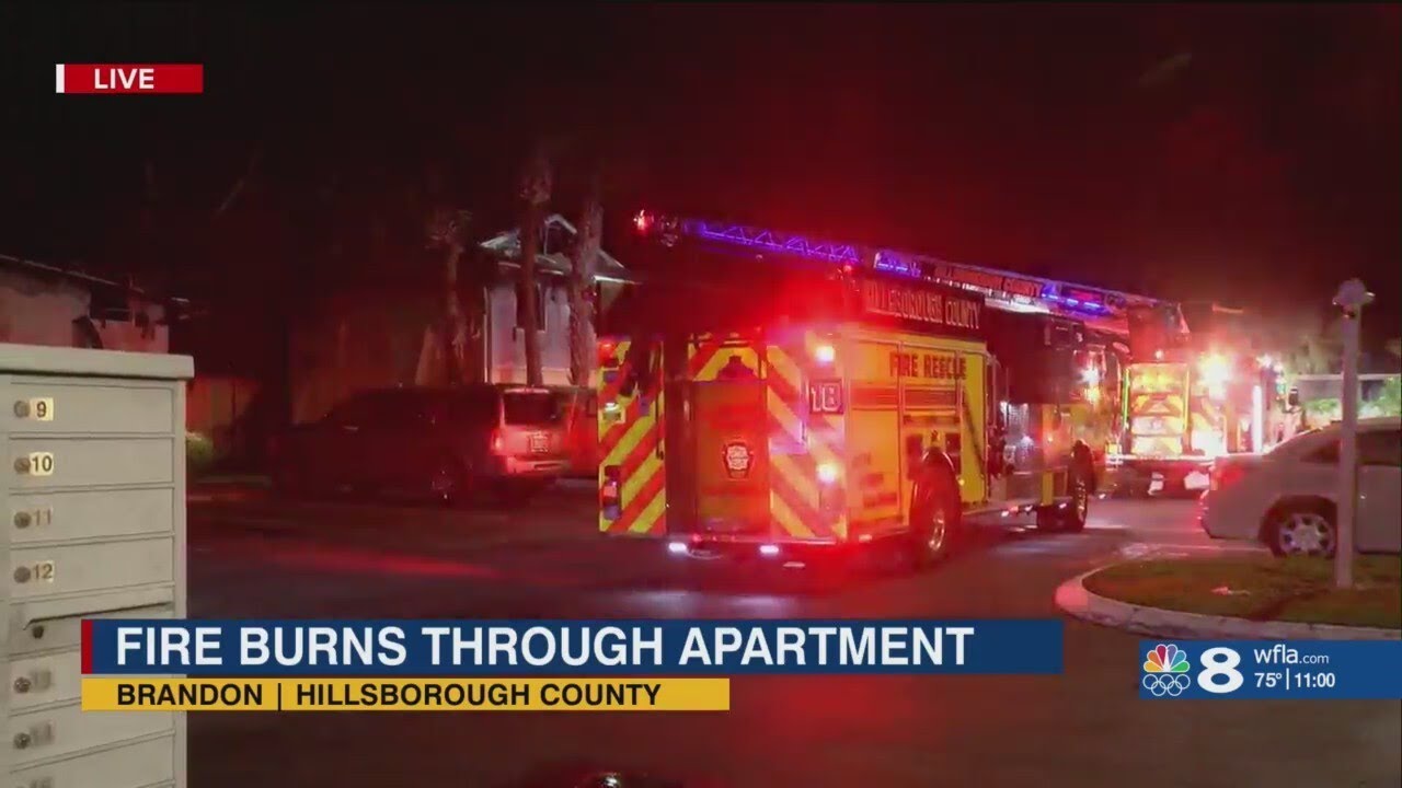 Heavy fire burns through Brandon apartment, displaces 12 families - YouTube