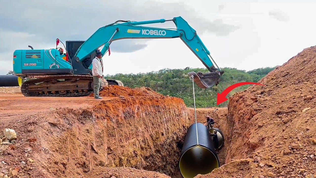 How Excavators Handle Giant Drainage Pipes – Construction Site Footage ...