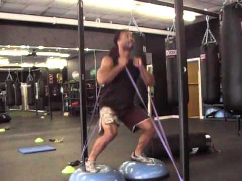 Brandon Farran doing bosu squats with resistance bands at Future ...