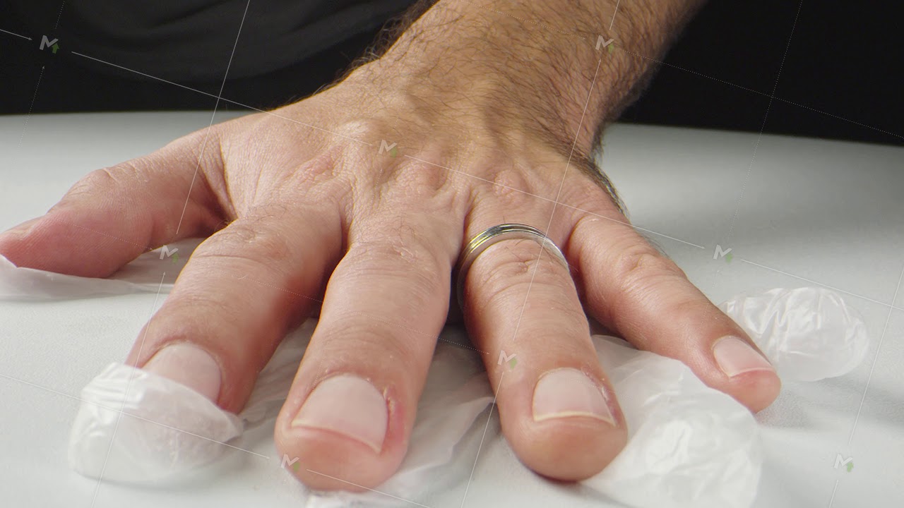 Macro shot of man's hands moving gloves toward camera - YouTube