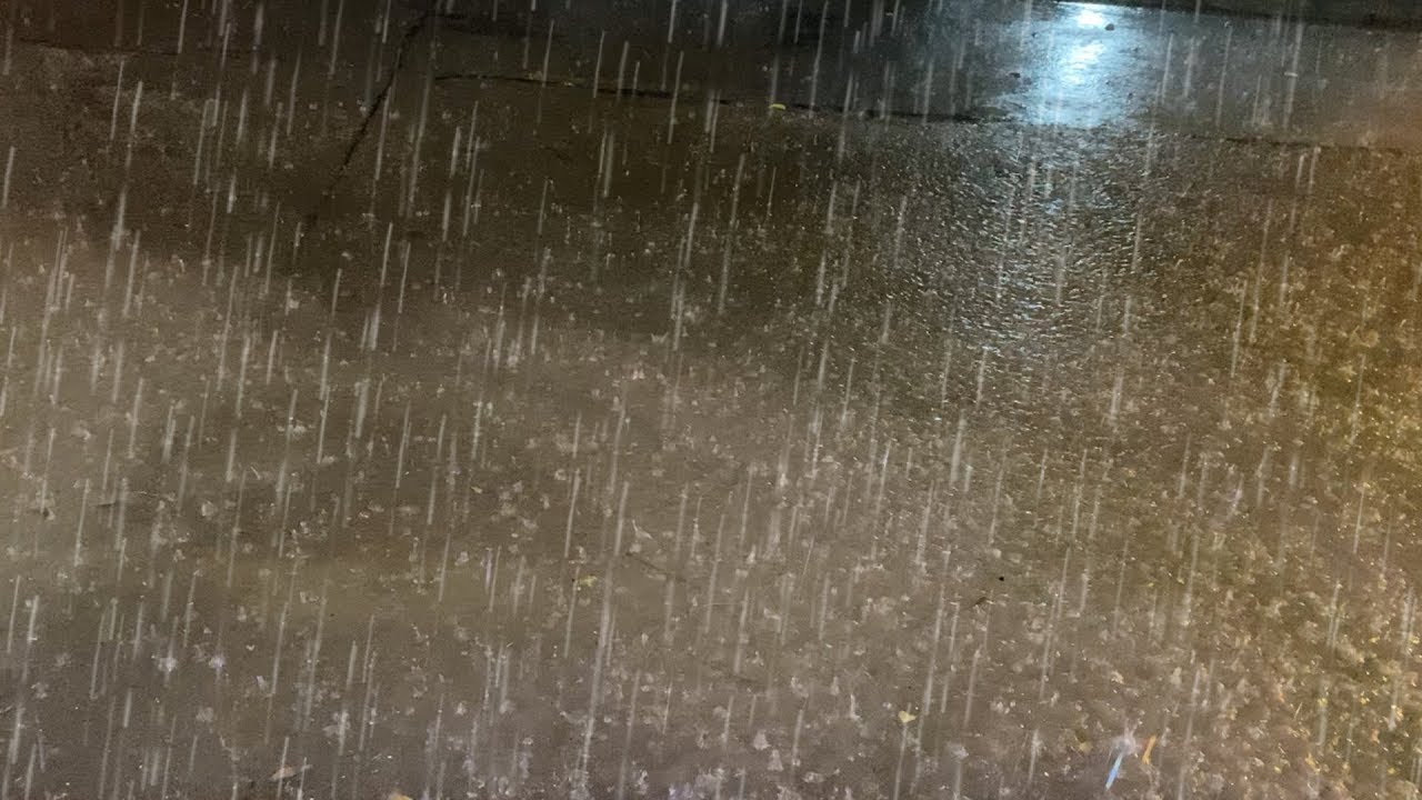 Heavy Rain Creates a Stream-Like Flow in an Alley in a Peaceful ...