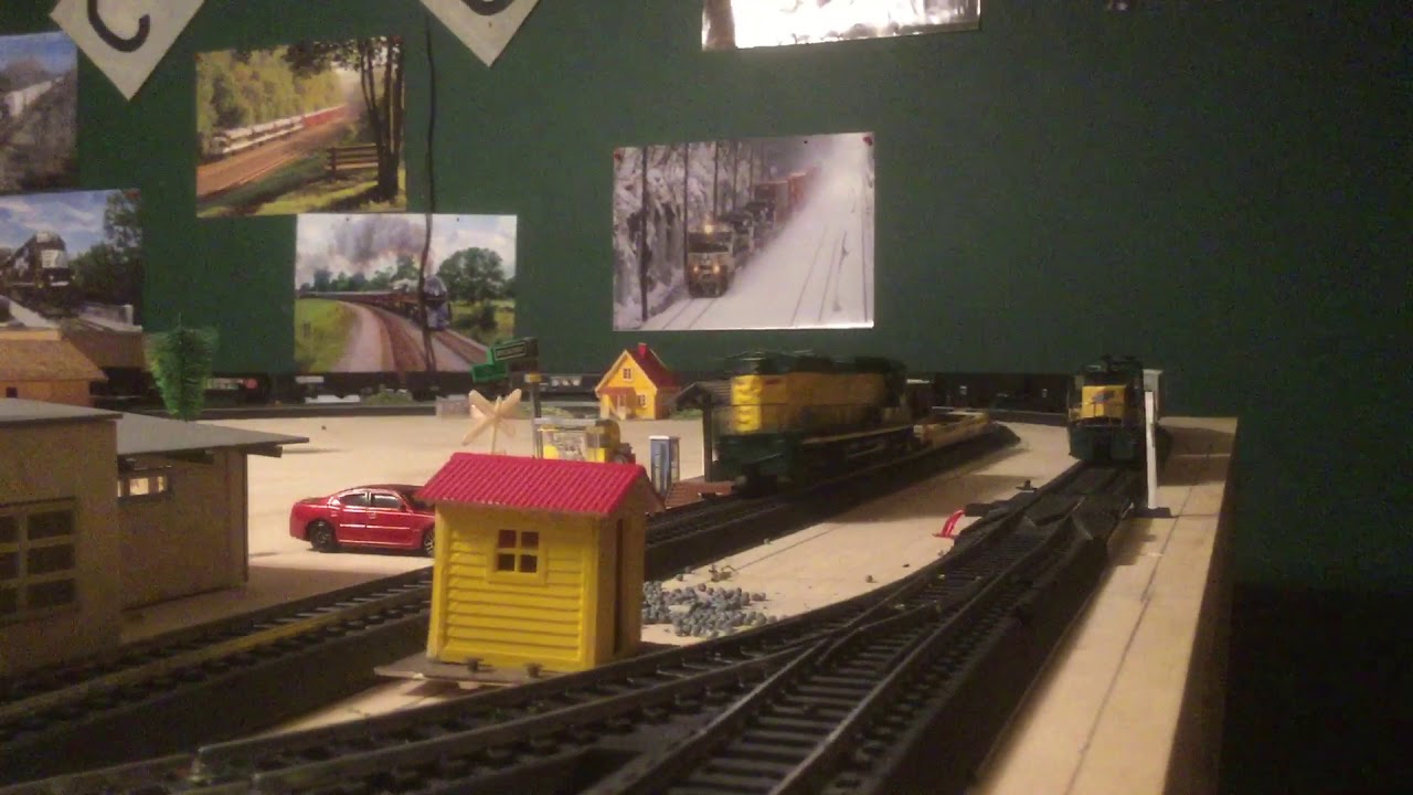 CNW c40-8 races CNW sd40-2 hauling a empty coal train - YouTube