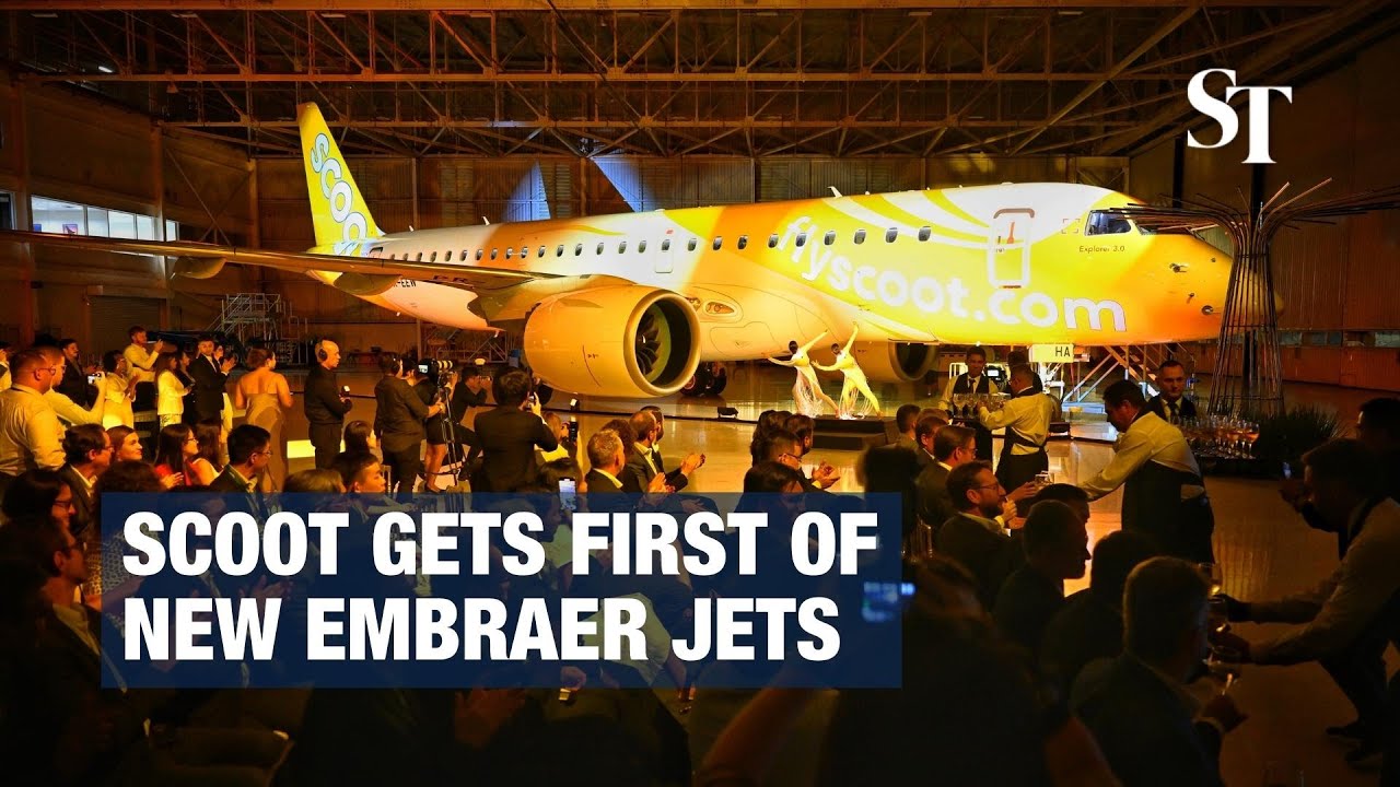 Scoot receives first jet of new Embraer fleet - YouTube