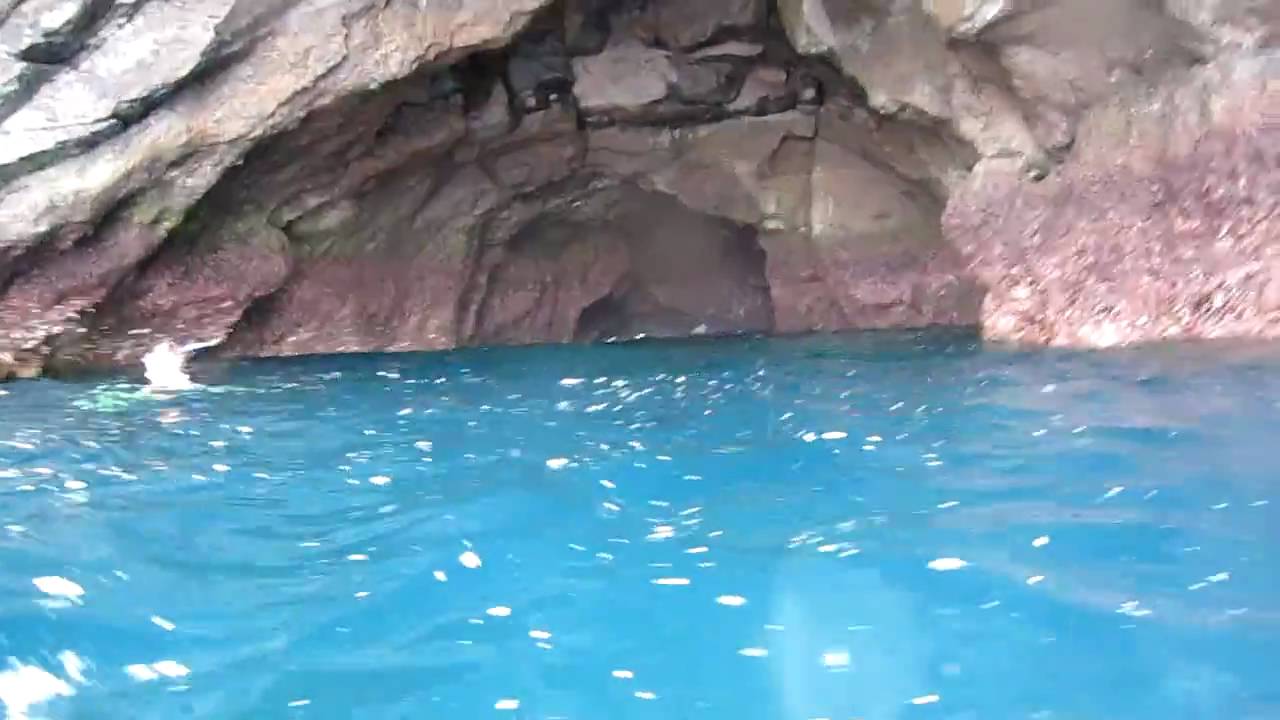 Water Rushing into Sea Cave on Sana Fe Island in the Galapagos - YouTube