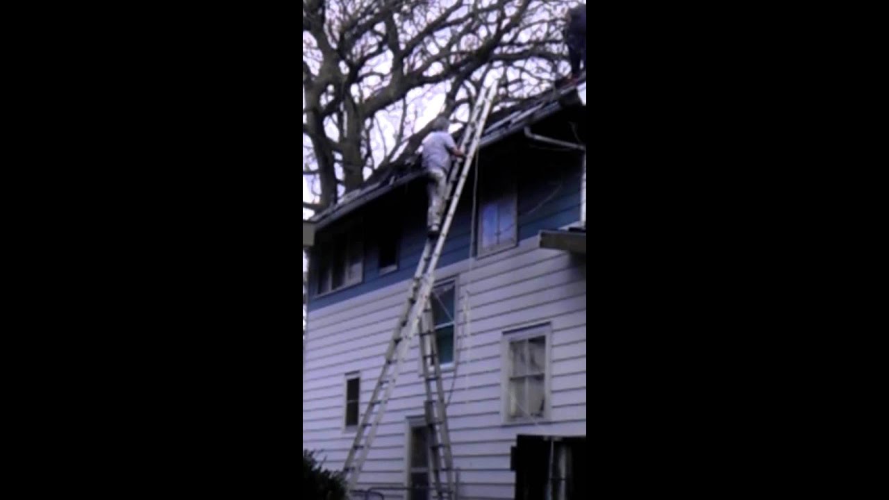 Crazy woman on ladder and roof - YouTube