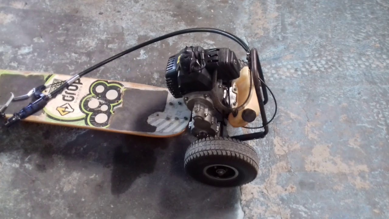 Exprementando skate a motor a gasolina após conserto - YouTube