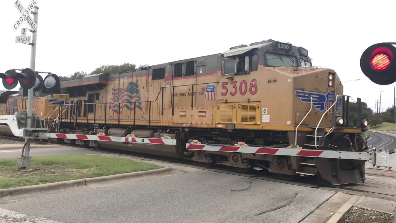 Southbound Union Pacific mix freight train and northbound Union Pacific ...