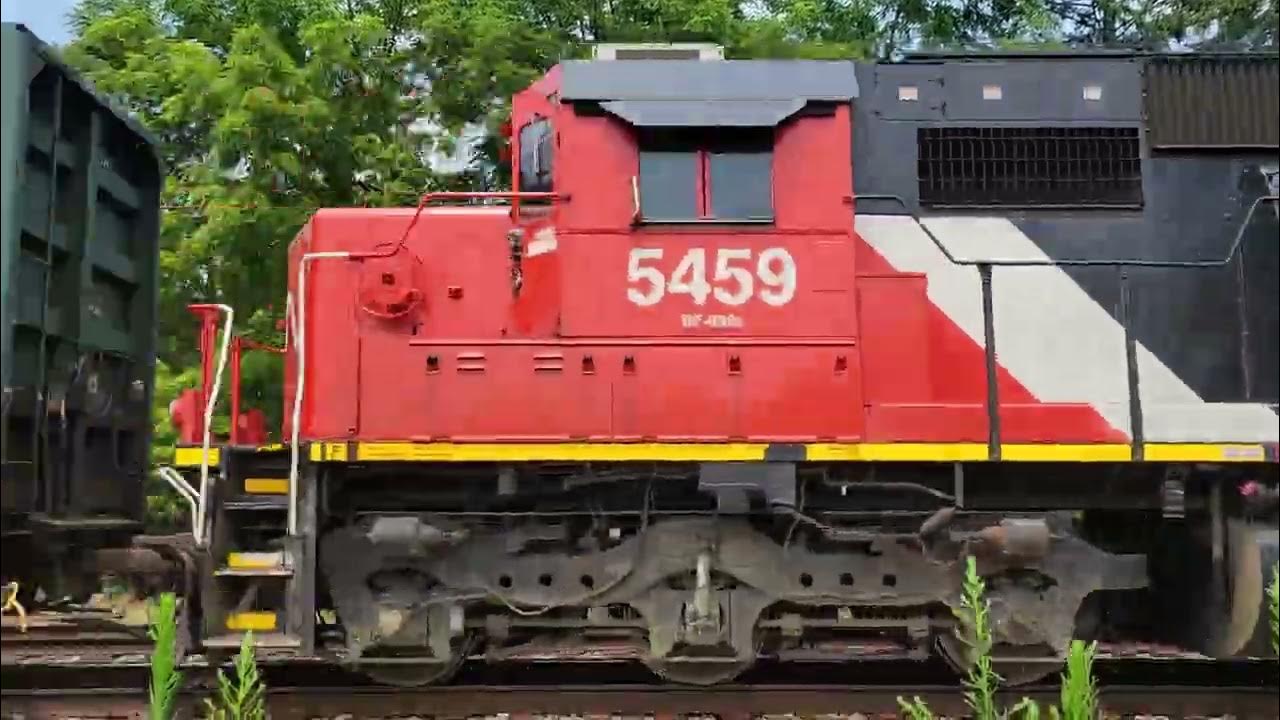 IC 6250, CN 5459 moving an Eastbound local freight train with hoppers through Vicksburg, MI ...