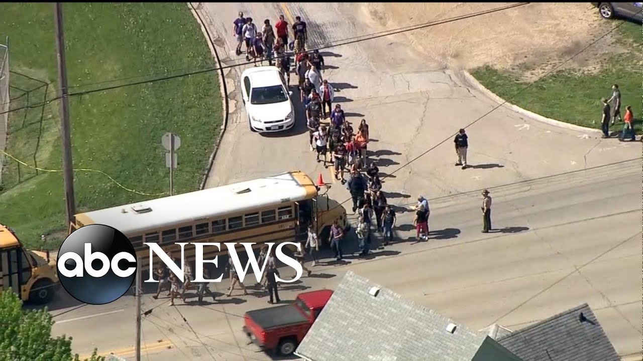 Officer shoots armed former student at Illinois high school - YouTube