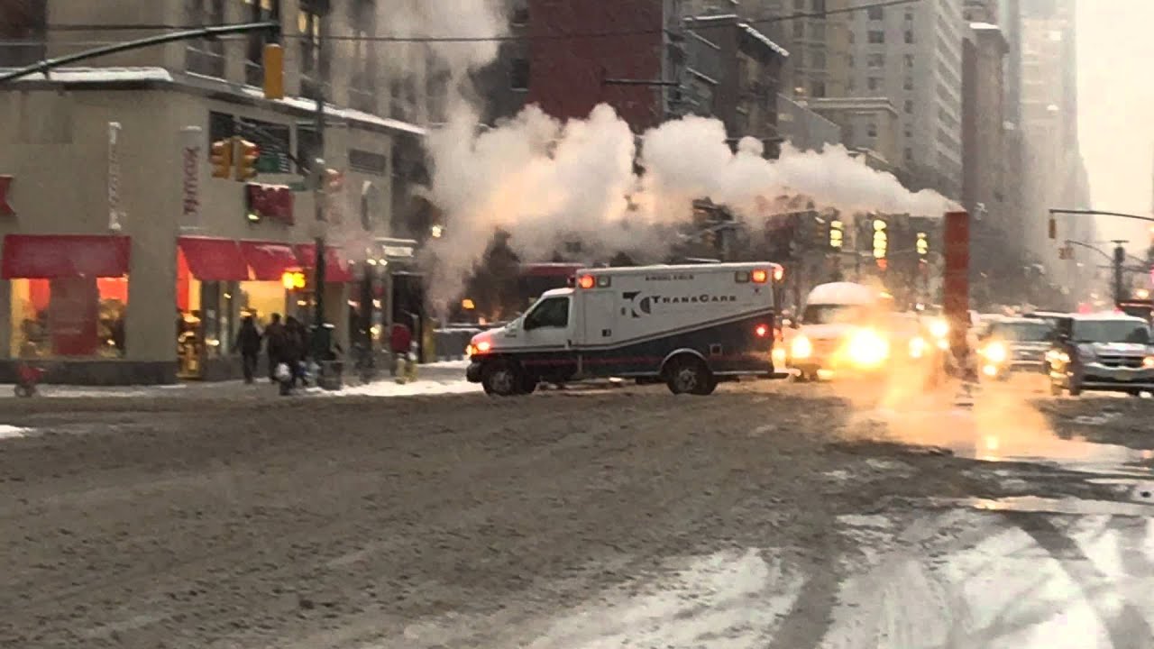 TRANSCARE EMS AMBULANCE RESPONDING ON W. 57TH ST. DURING SNOW STORM IN ...