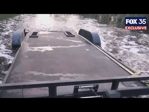 Florida's 'Water Uber' hero tows neighbors through flooded street to ...