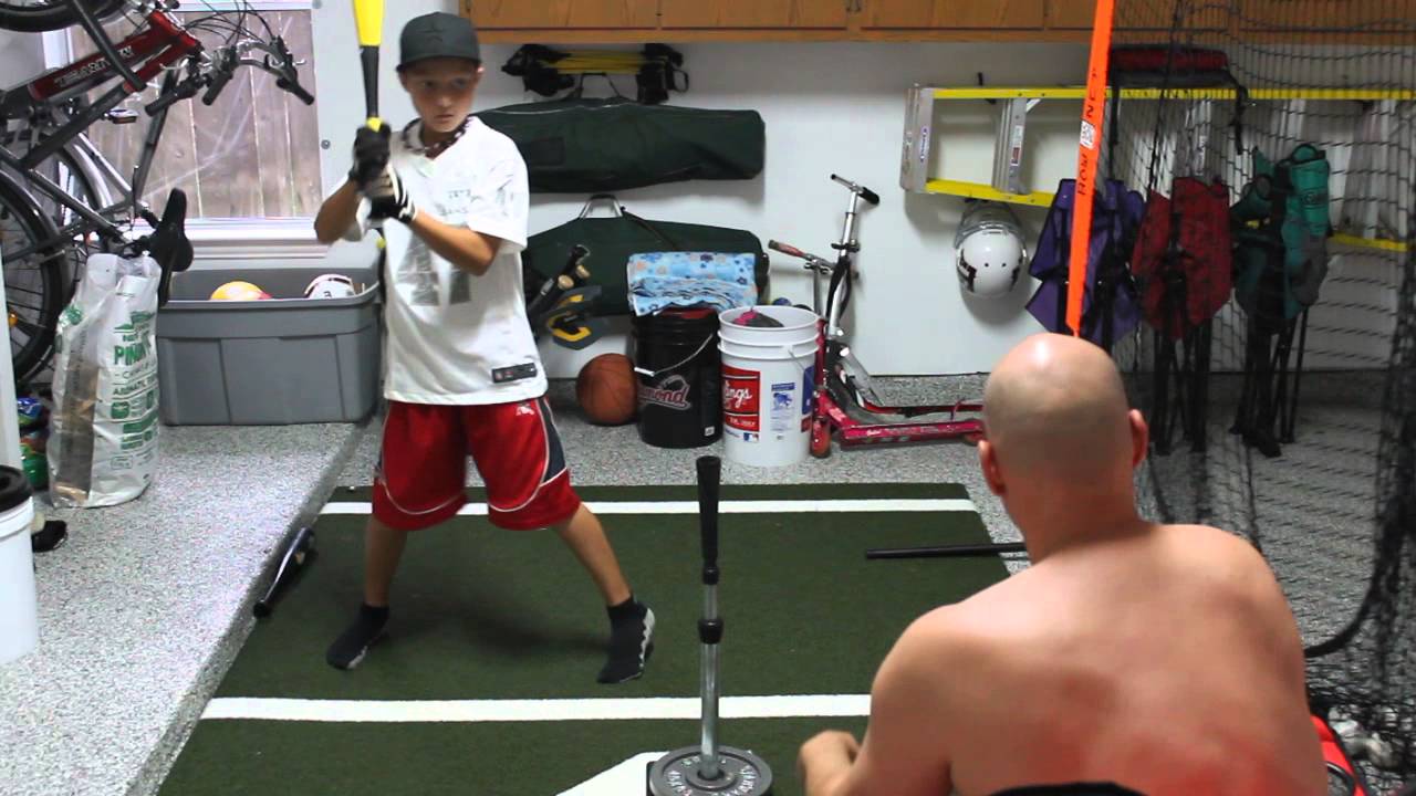 10 year old hitting off of a baseball tee in garage - YouTube