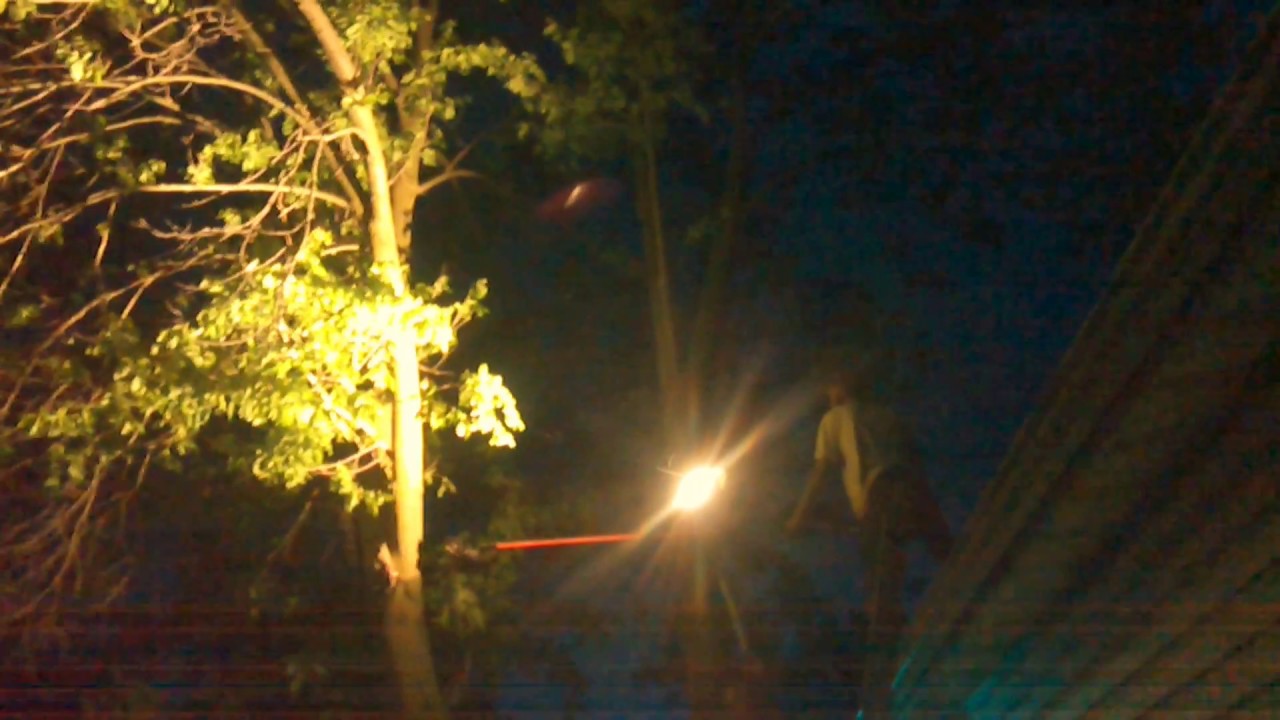 Pole saw by bug zapper light - YouTube