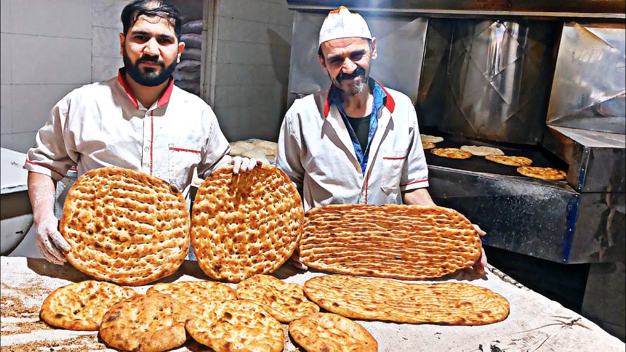 Two brothers bake red bread and kebabs in a bakery: Baking bread in a ...