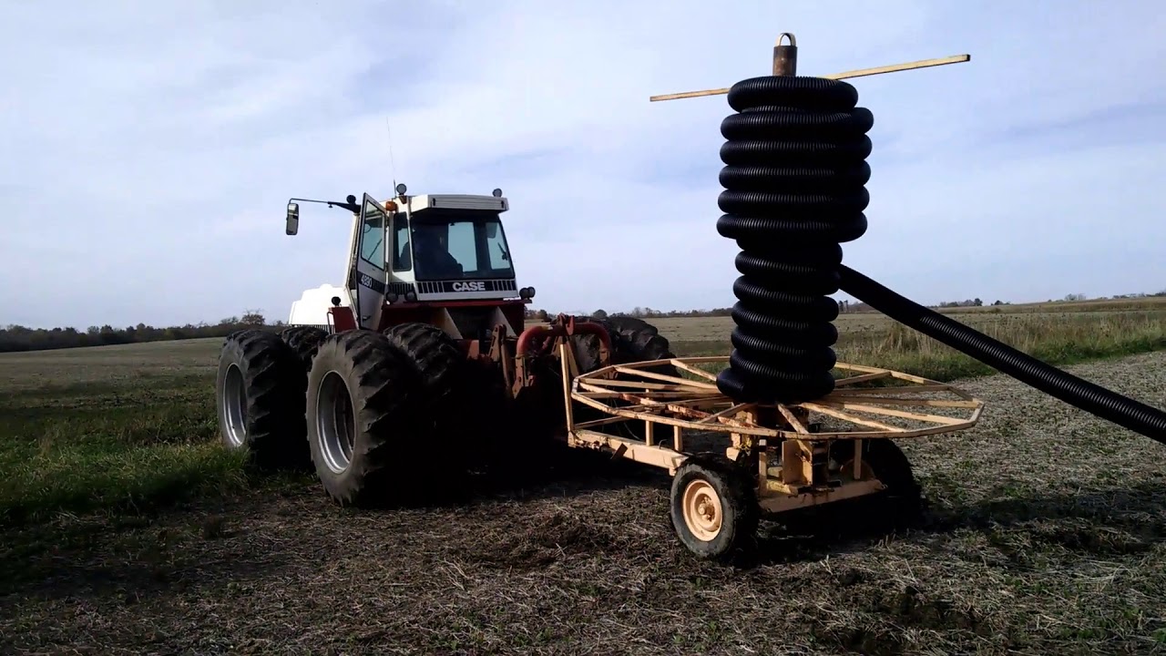 Unrolling drain tile off the tile cart 26 October 2017 - YouTube