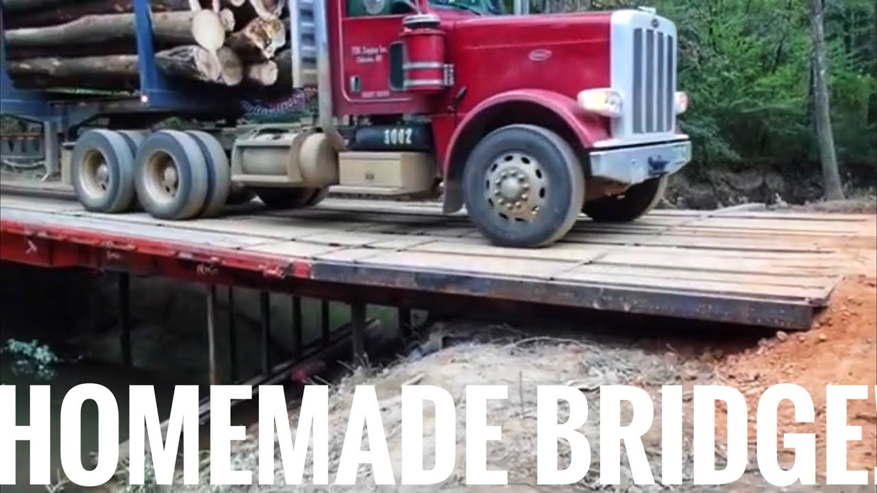 Peterbilt log truck on a homemade bridge - YouTube