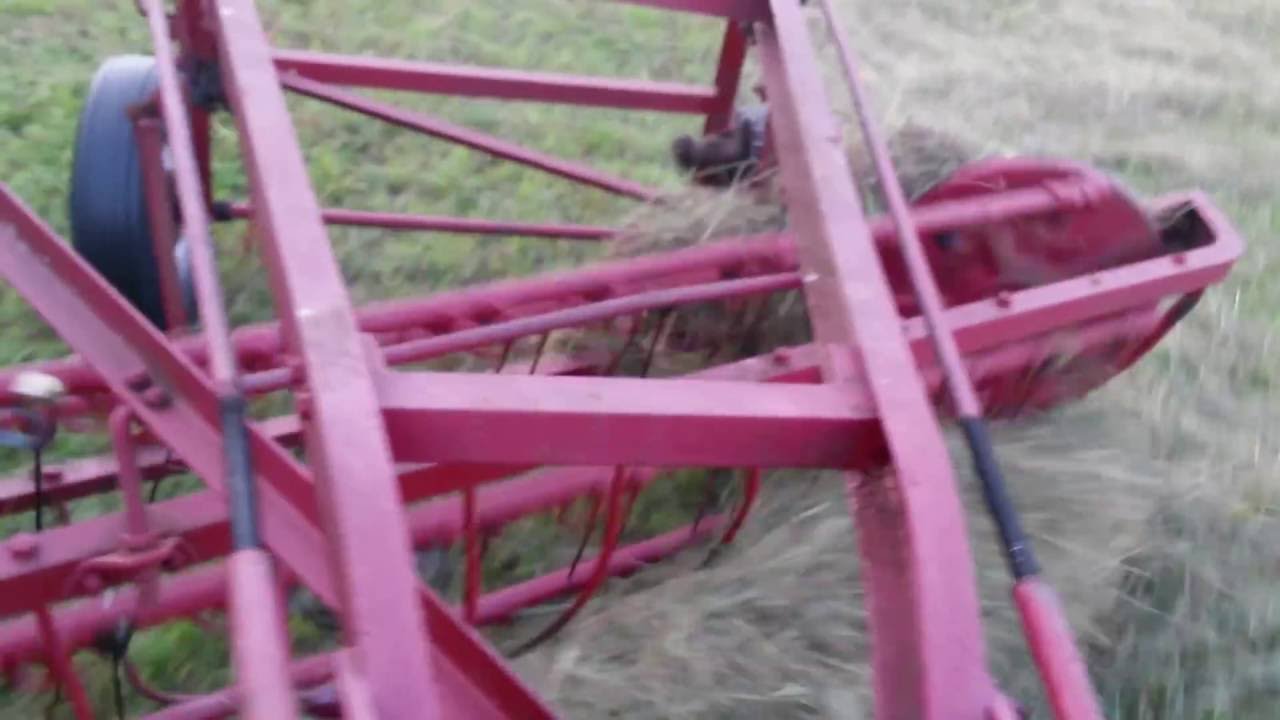 farmall super c raking hay - YouTube