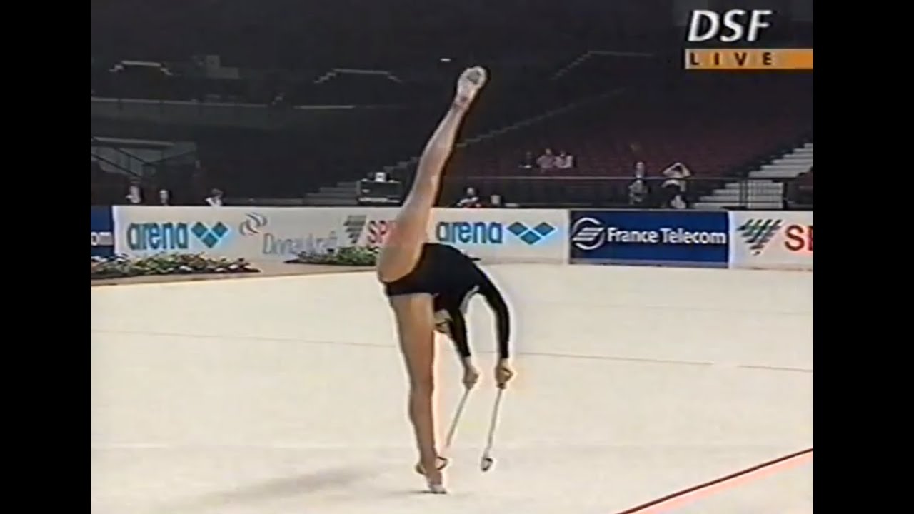 Beautiful flexible girl gymnast in leotard stretch her contortion ...