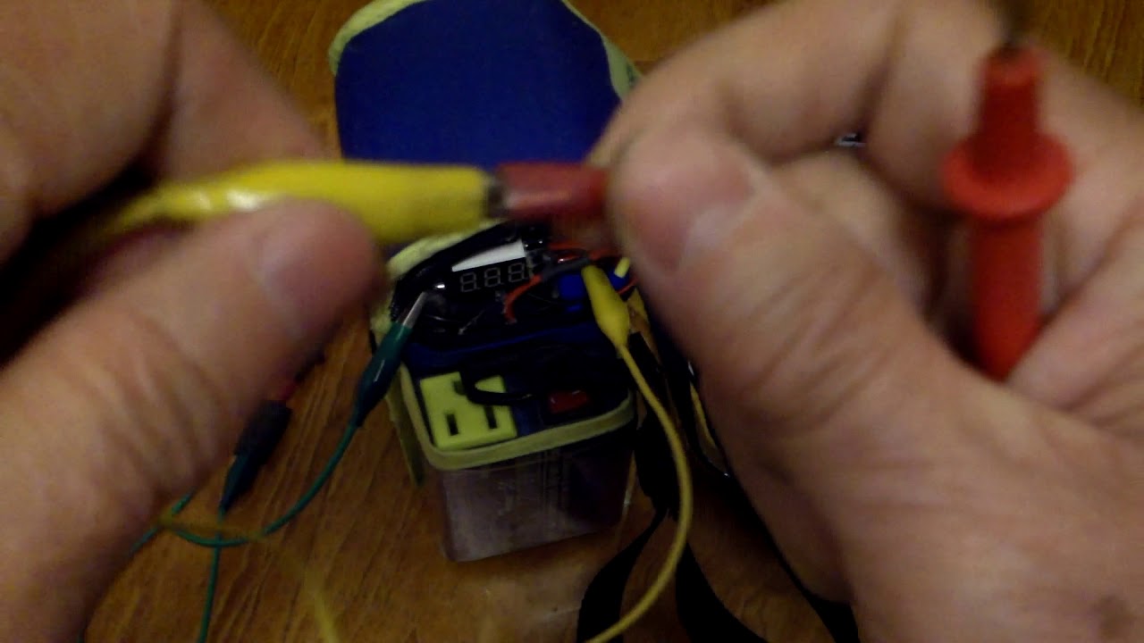 Attaching temporary alligator clips to multimeter probes in a secure ...