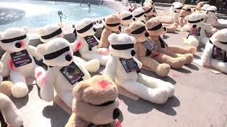 Blindfolded teddy bears in Tel Aviv bare photos of Hamas-kidnapped children