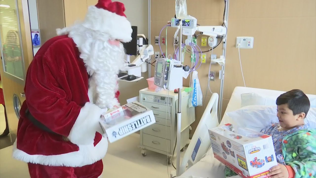 Santa delivers gifts to local hospital's littlest patients - YouTube