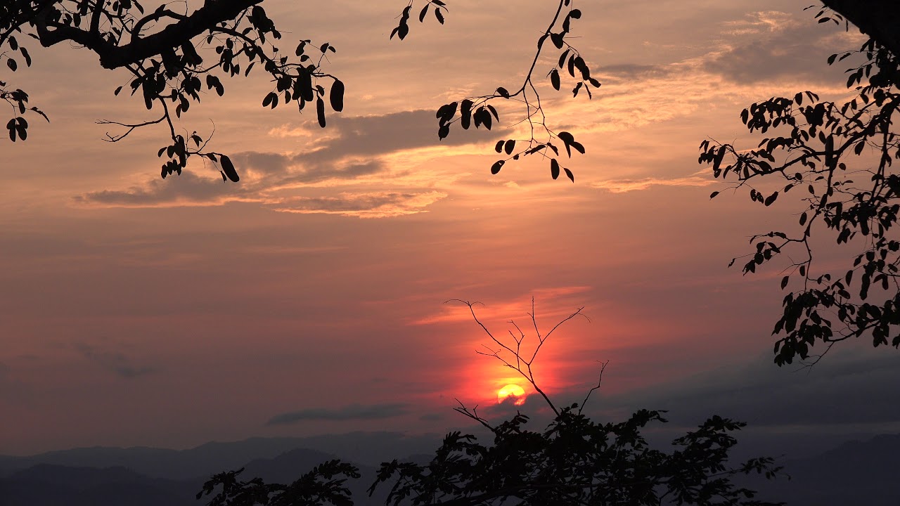 A beautiful sunrise over a mountain and forest. - YouTube