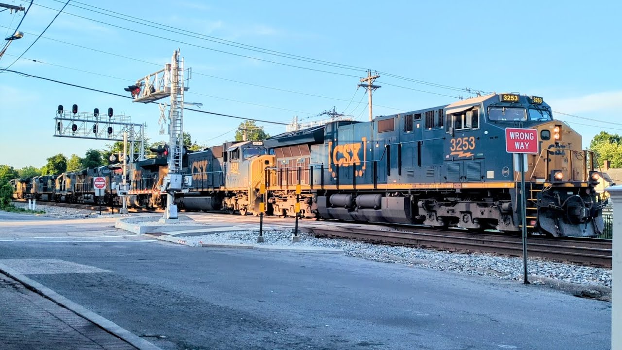 Eight locomotives (with about half running) crossing Sharon Ave ...
