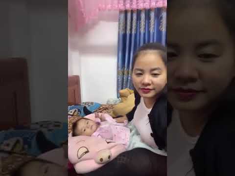 BREASTFEEDING BABY BY BEAUTIFUL MOTHER.